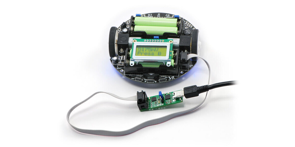 Pololu 3pi robot with an Orangutan USB programmer connected to its ISP port.